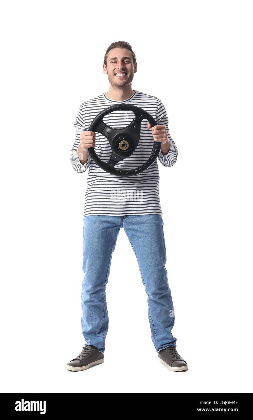 Young man with steering wheel on white background Stock Photo - Alamy