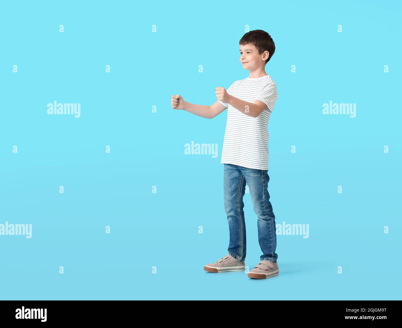 Cute little boy with imaginary steering wheel on color background Stock ...