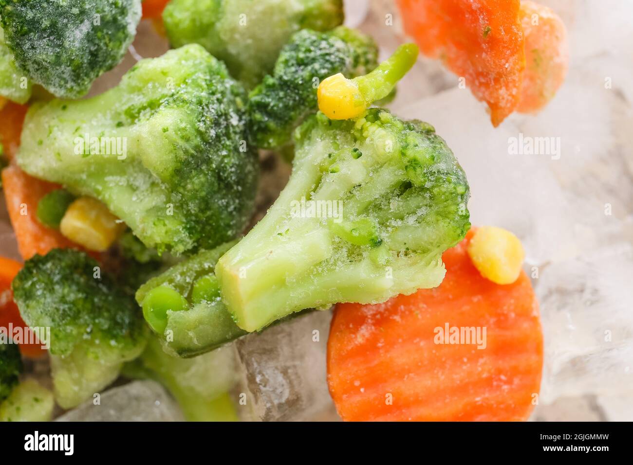 Frozen vegetables and ice cubes as background, closeup Stock Photo - Alamy