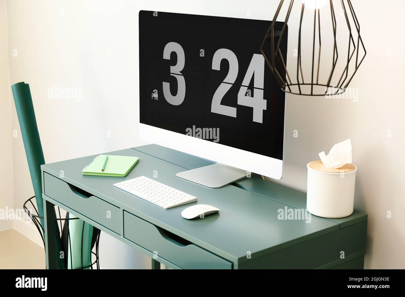 Modern workplace with computer near light wall Stock Photo - Alamy