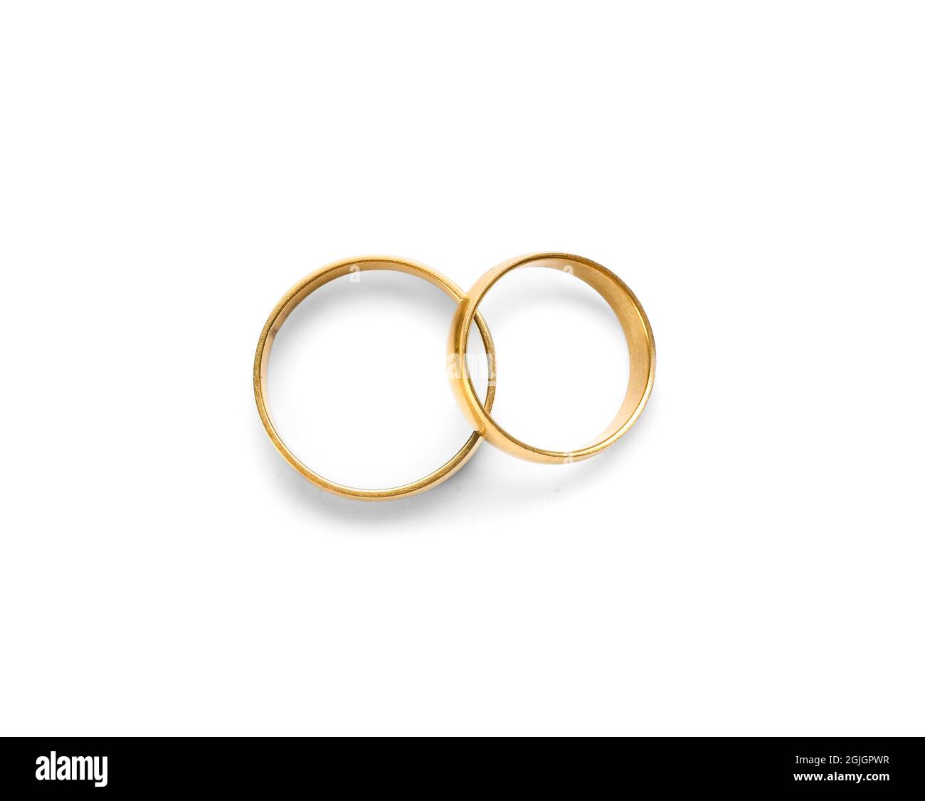 Pair of wedding rings on white background Stock Photo - Alamy