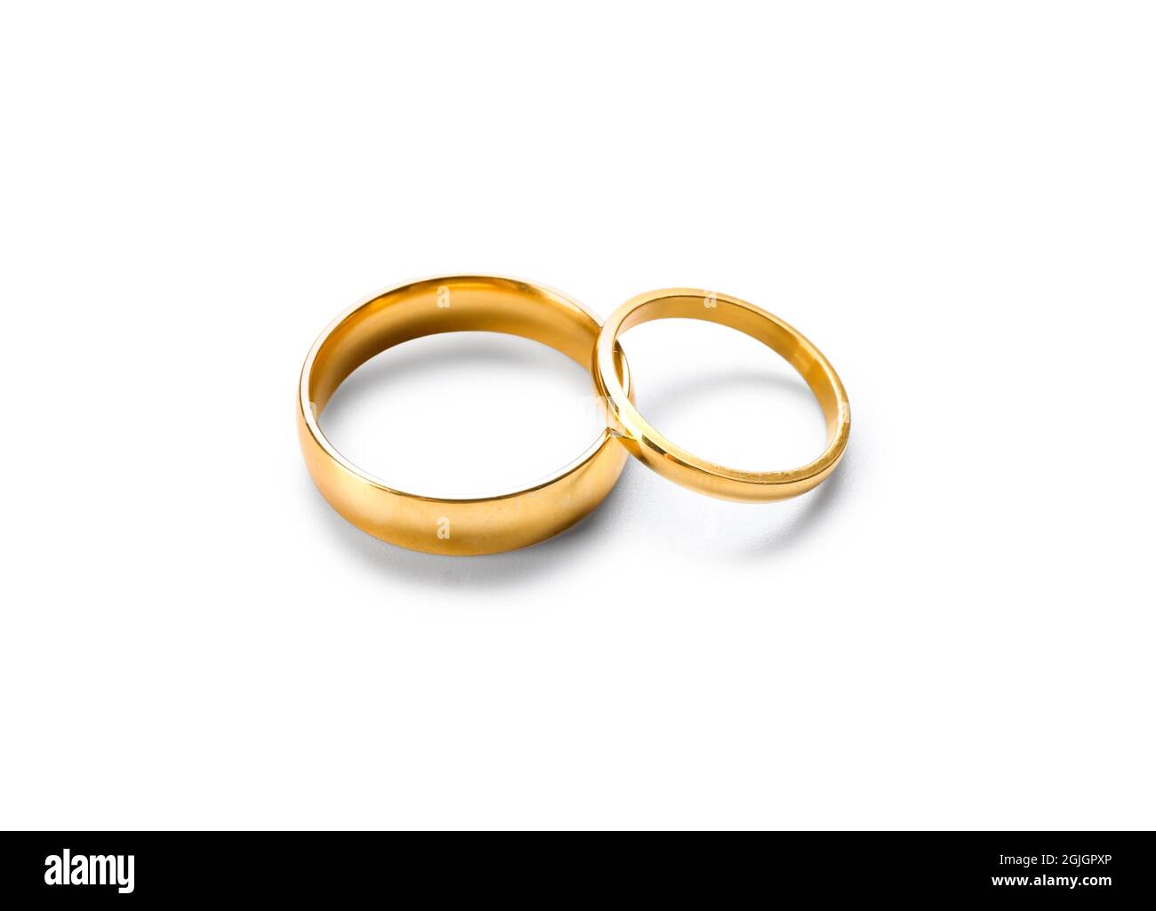 Pair of wedding rings on white background Stock Photo - Alamy