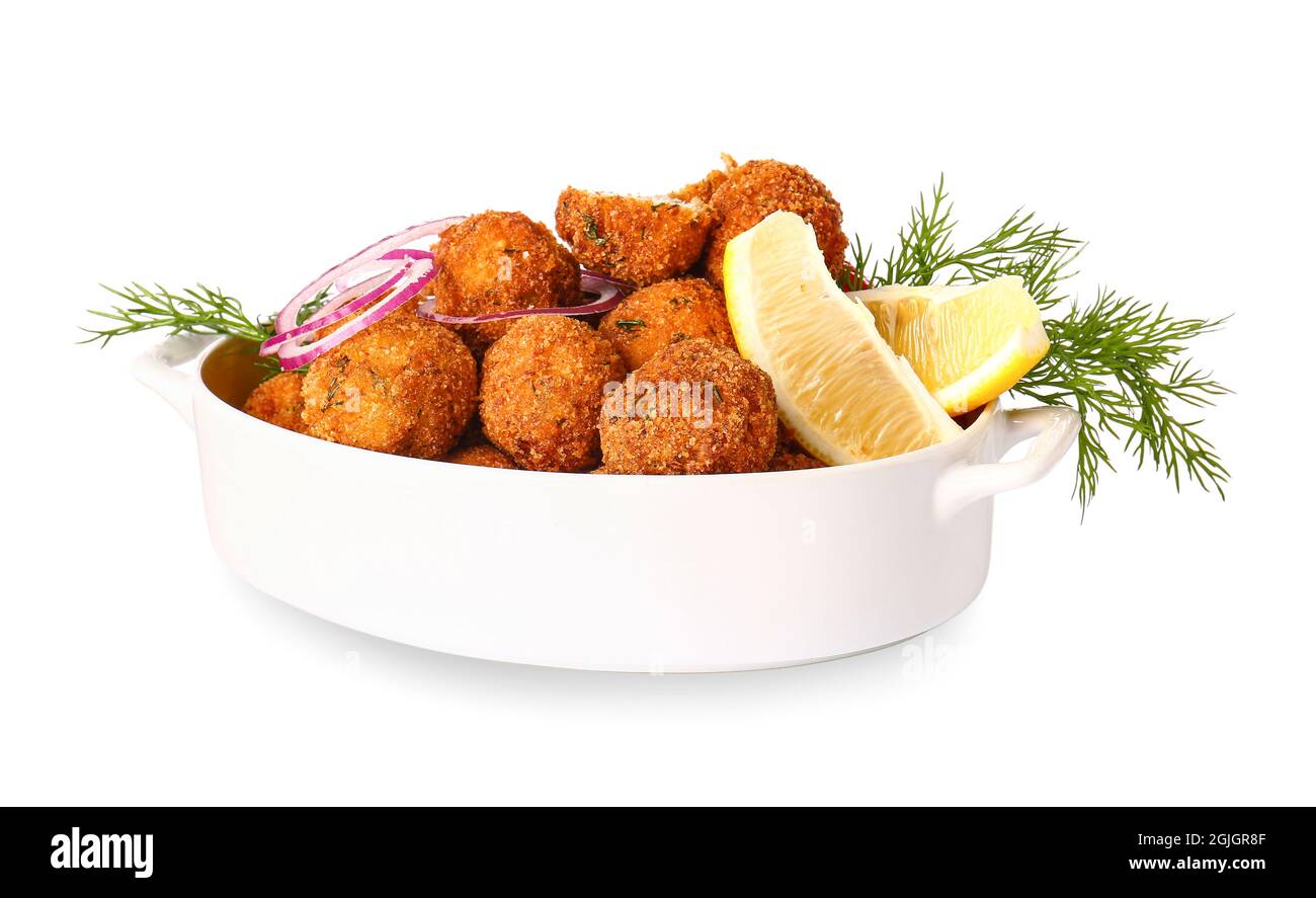 Baking dish with tasty cod cutlets on white background Stock Photo - Alamy