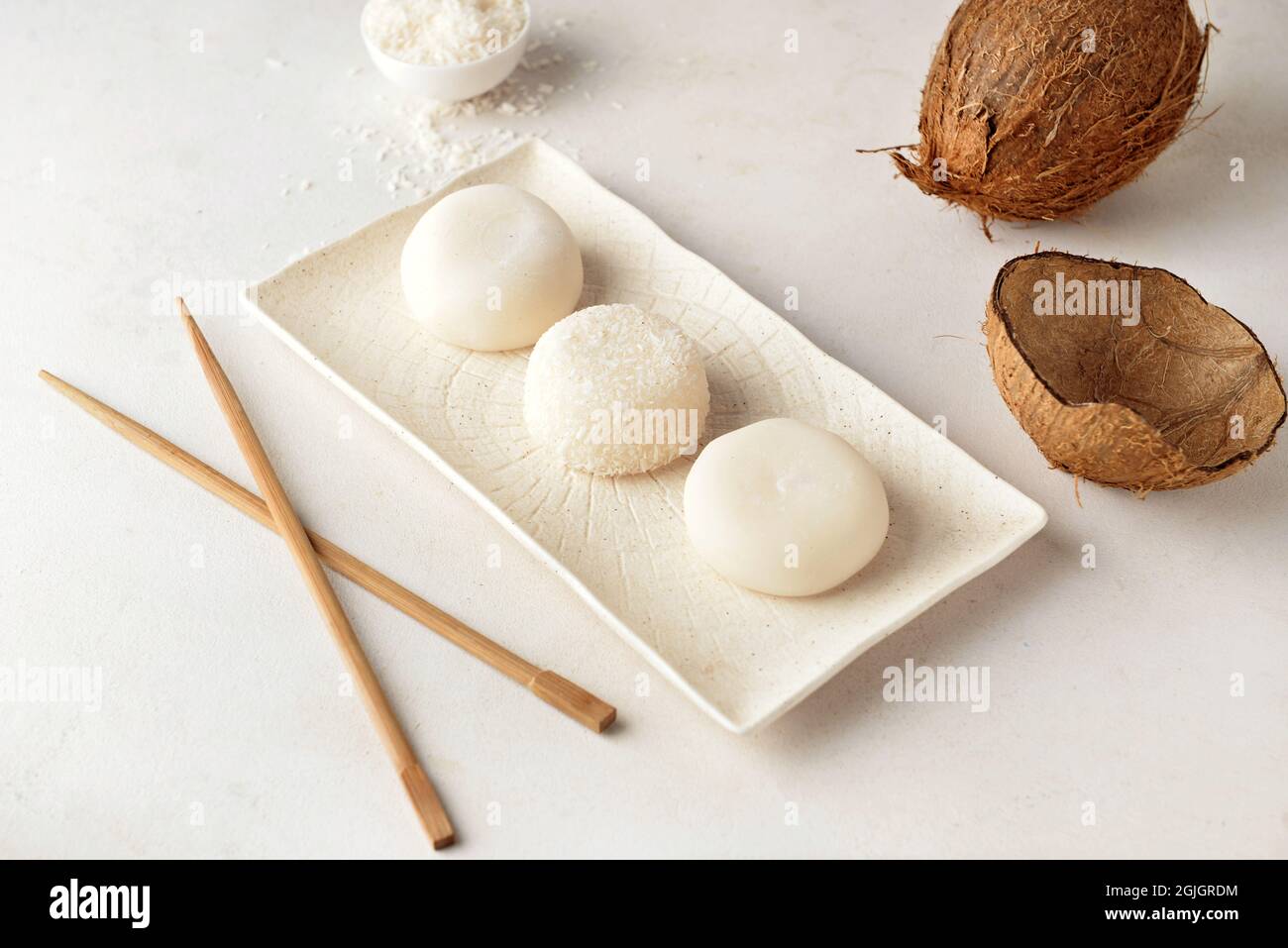 Tray with tasty Japanese mochi and chopsticks on light background Stock ...