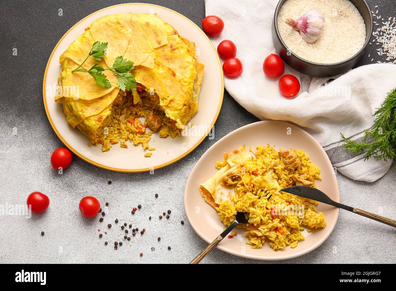 Plates with tasty Shah Pilaf on black and white background Stock Photo ...