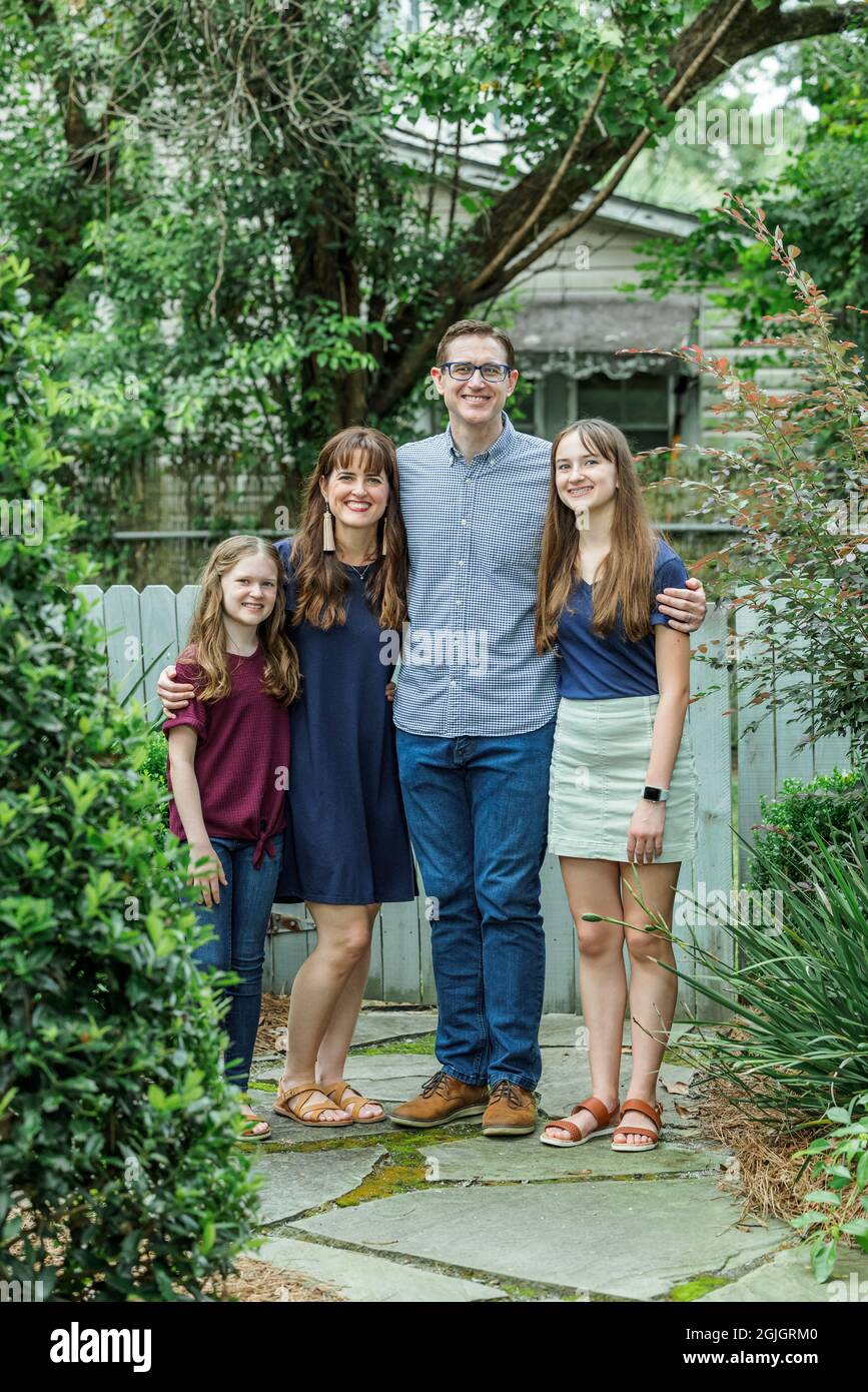 Family standing outside their house hi-res stock photography and images ...