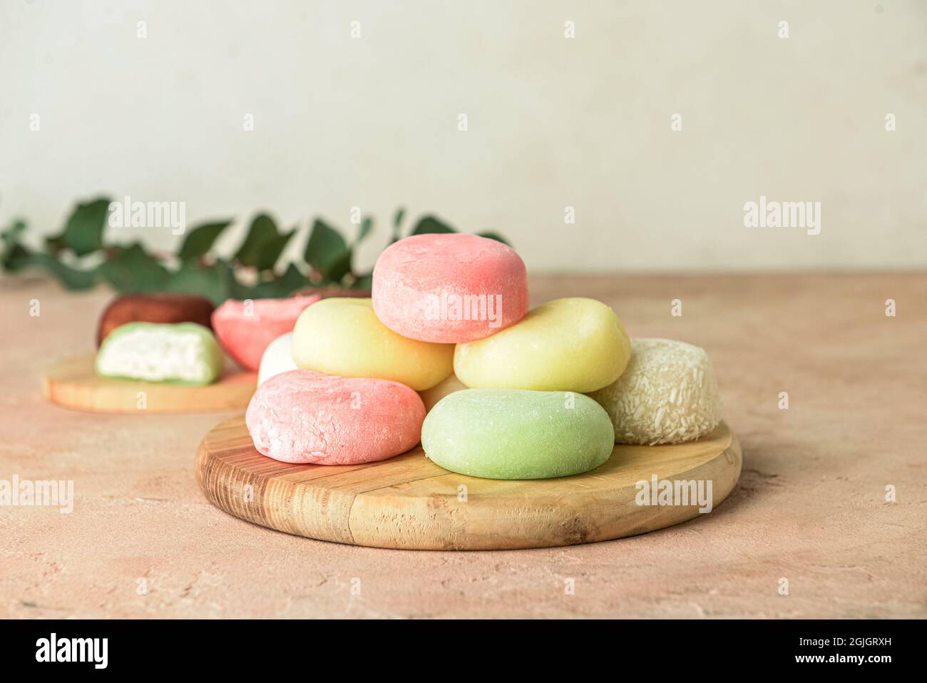 Wooden board with tasty Japanese mochi on table Stock Photo - Alamy