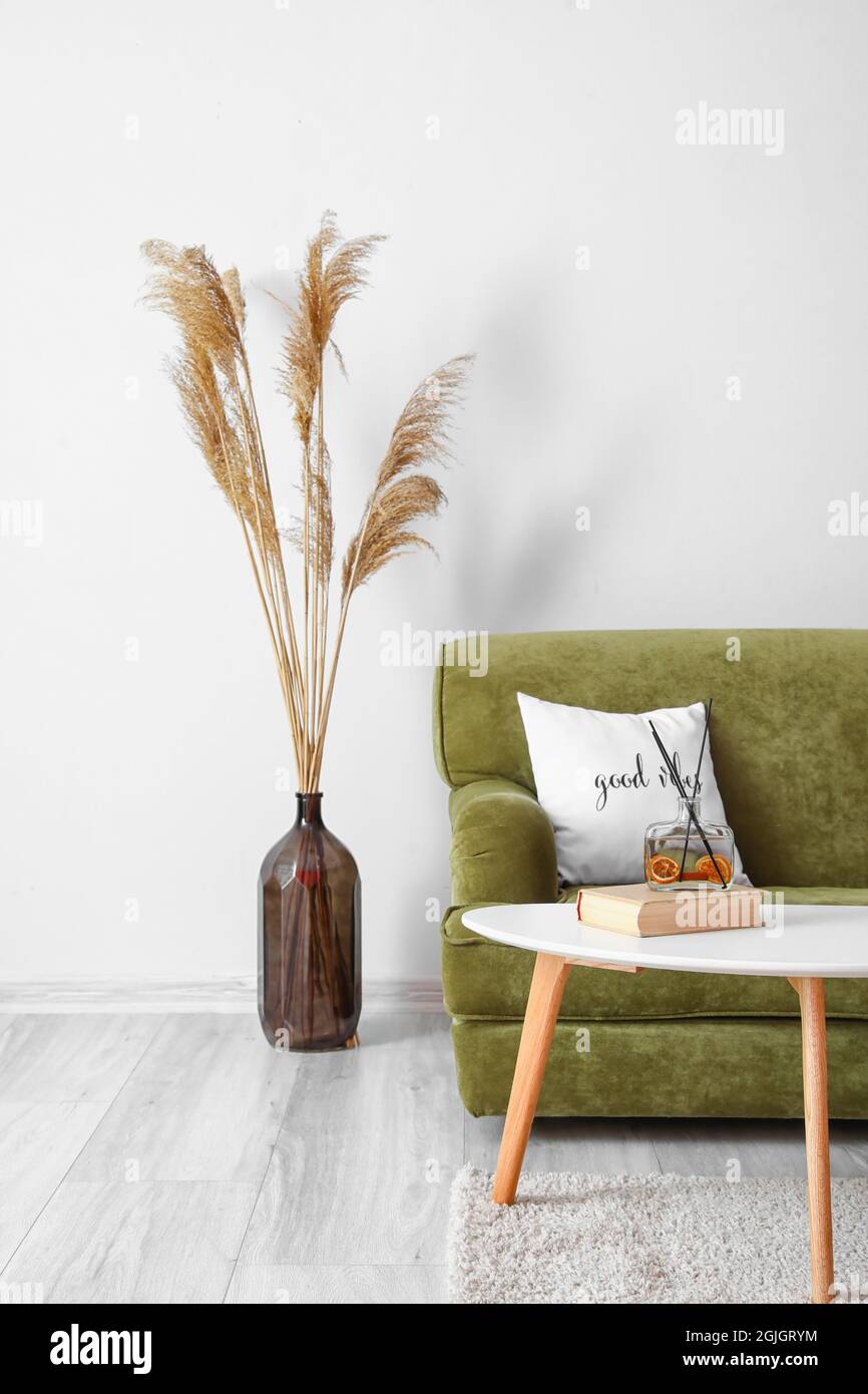 Interior of modern room with table and sofa Stock Photo - Alamy