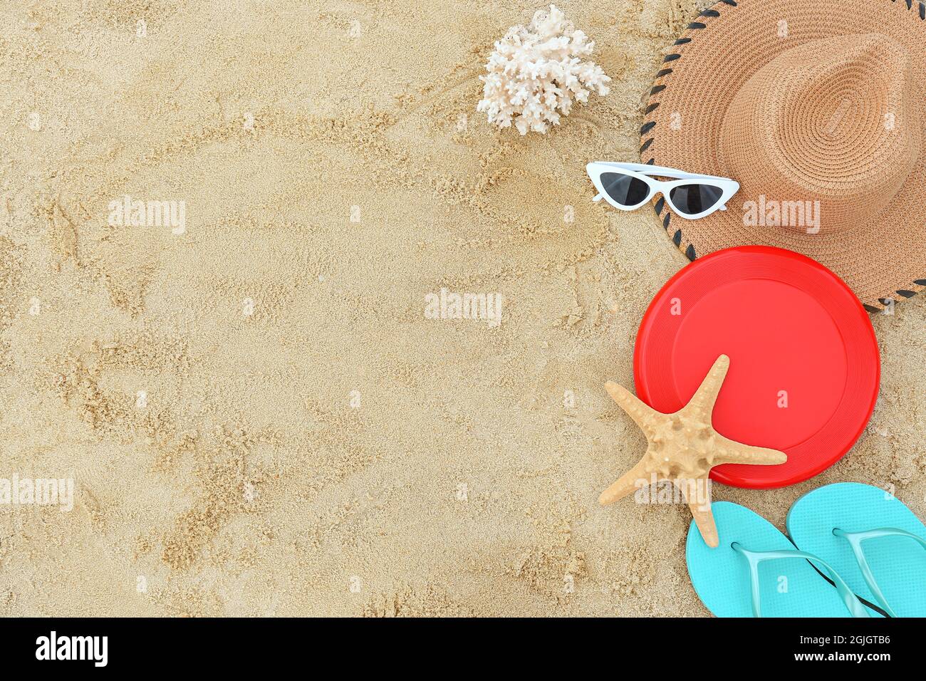 Composition with frisbee disk and beach accessories on sand Stock Photo ...