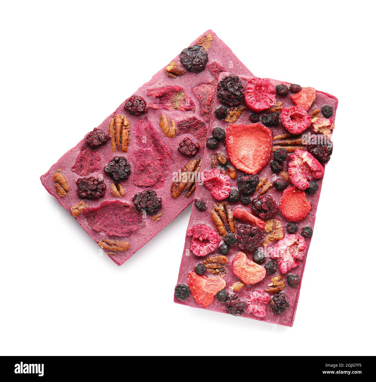 Handmade chocolate bars with fruits, berries and nuts on white ...