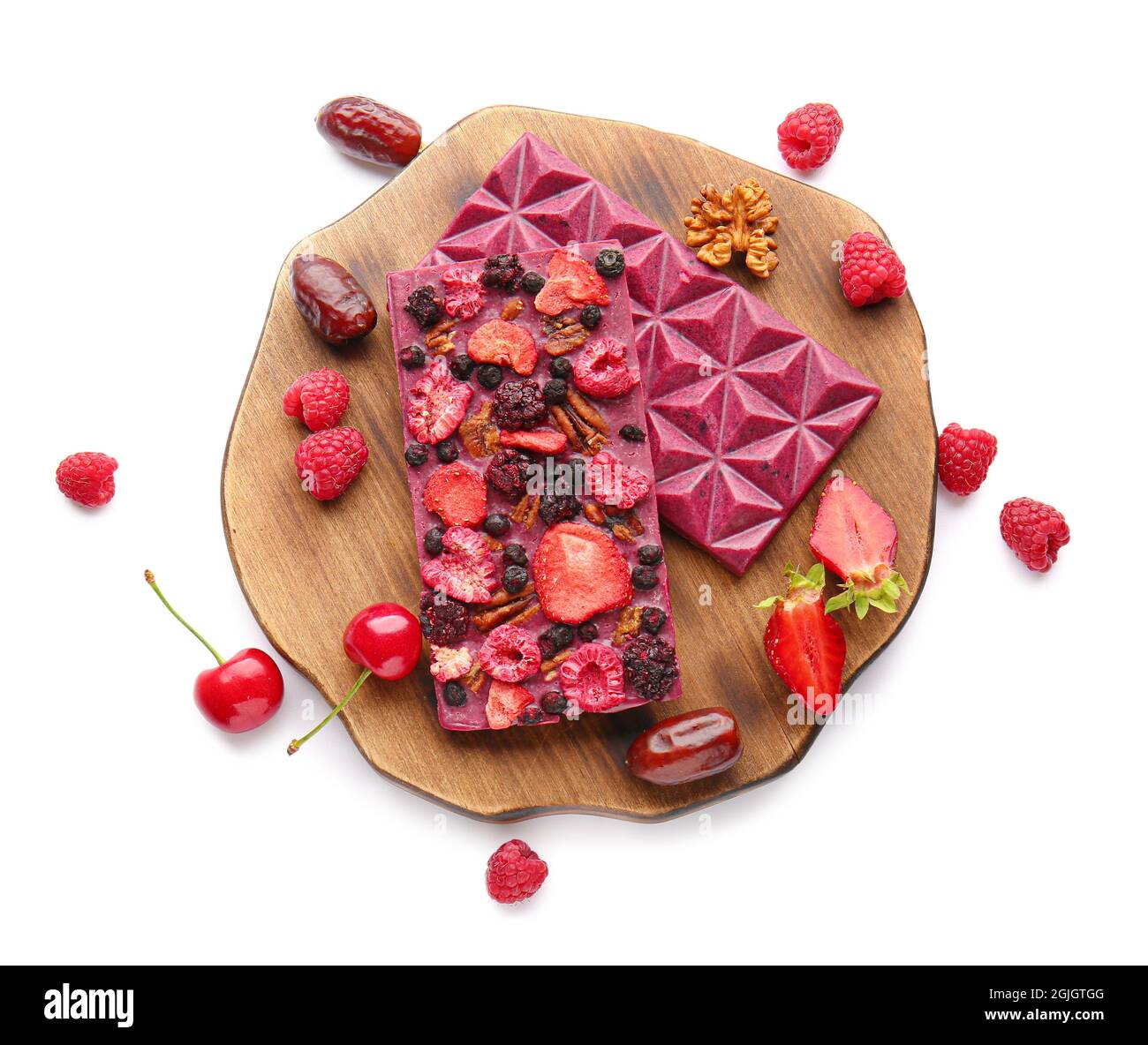 Handmade chocolate bars with fruits, berries and nuts on white ...