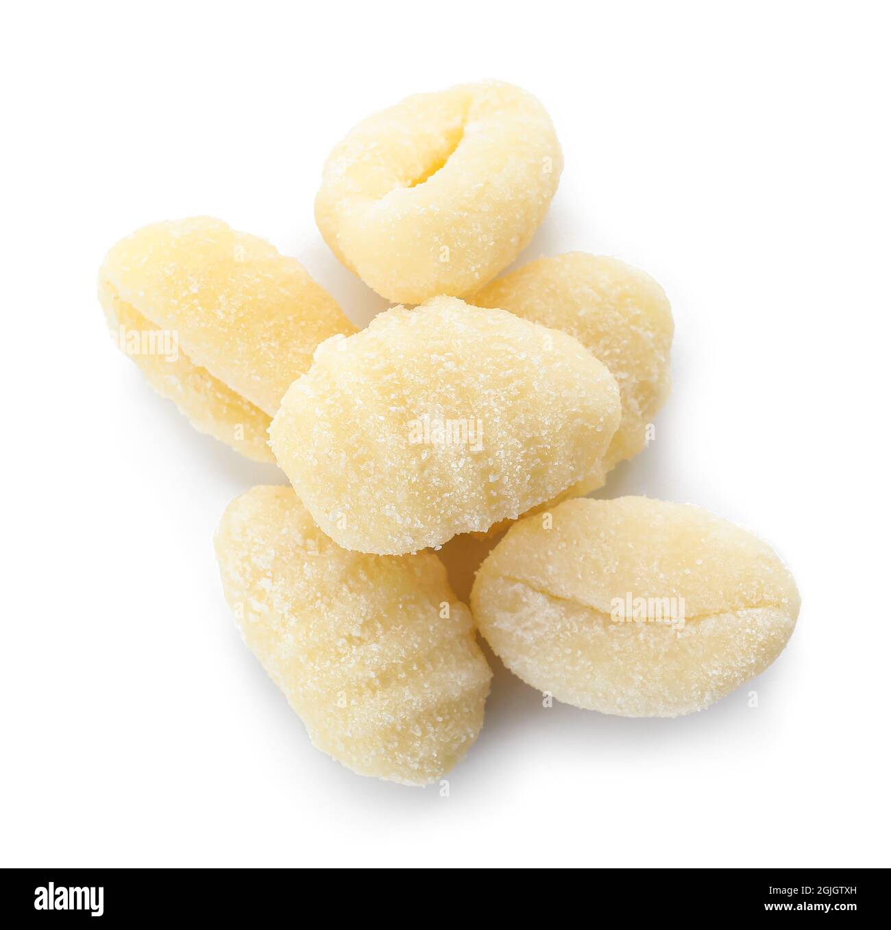 Raw gnocchi on white background Stock Photo - Alamy