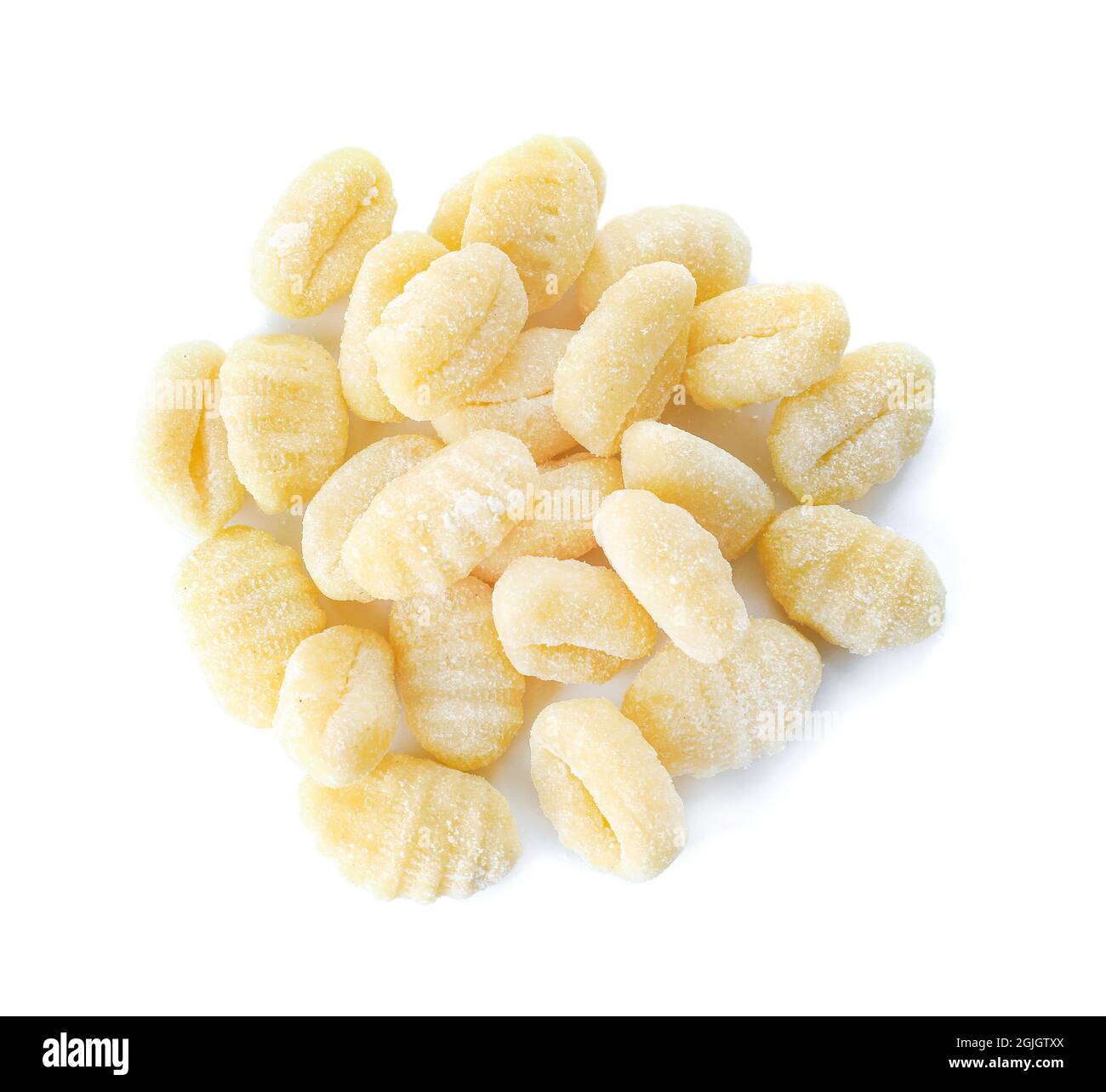 Raw gnocchi on white background Stock Photo - Alamy