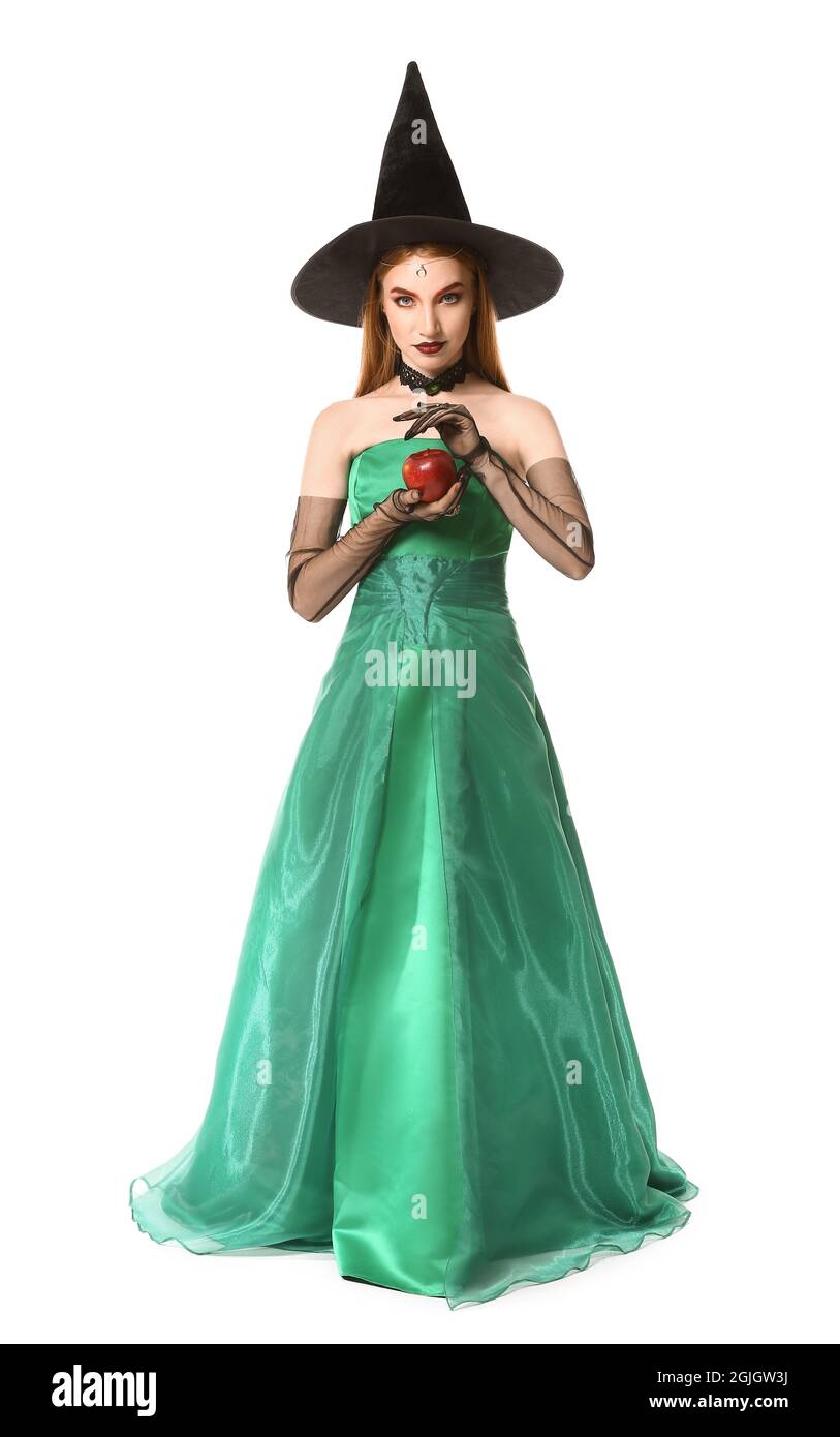 Young witch with apple on white background Stock Photo - Alamy