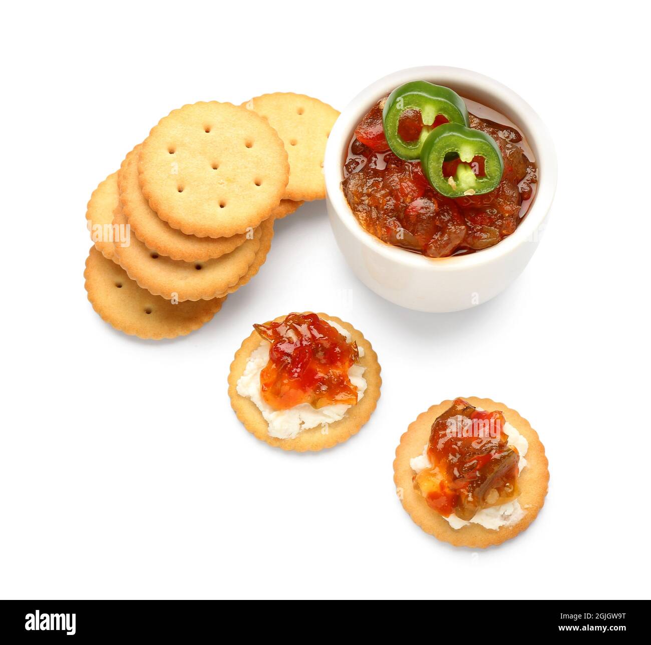 Delicious crackers with cottage cheese and jalapeno pepper jam on white ...