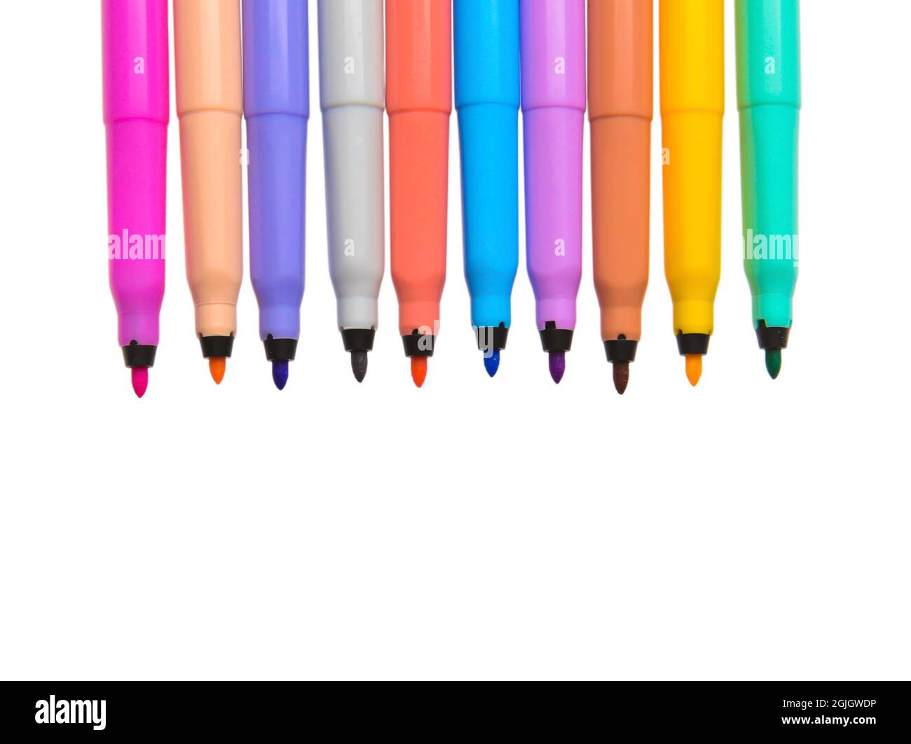 Different colorful markers on white background Stock Photo - Alamy