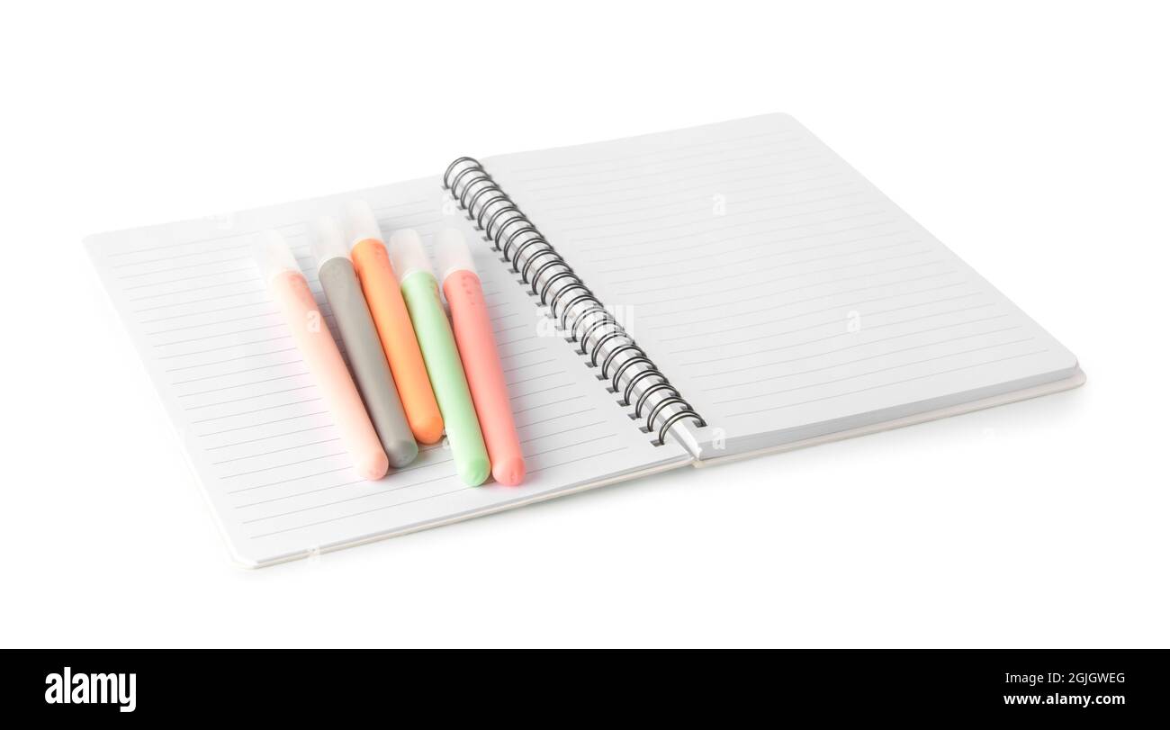 Opened notebook and felt tip pens on white background Stock Photo - Alamy