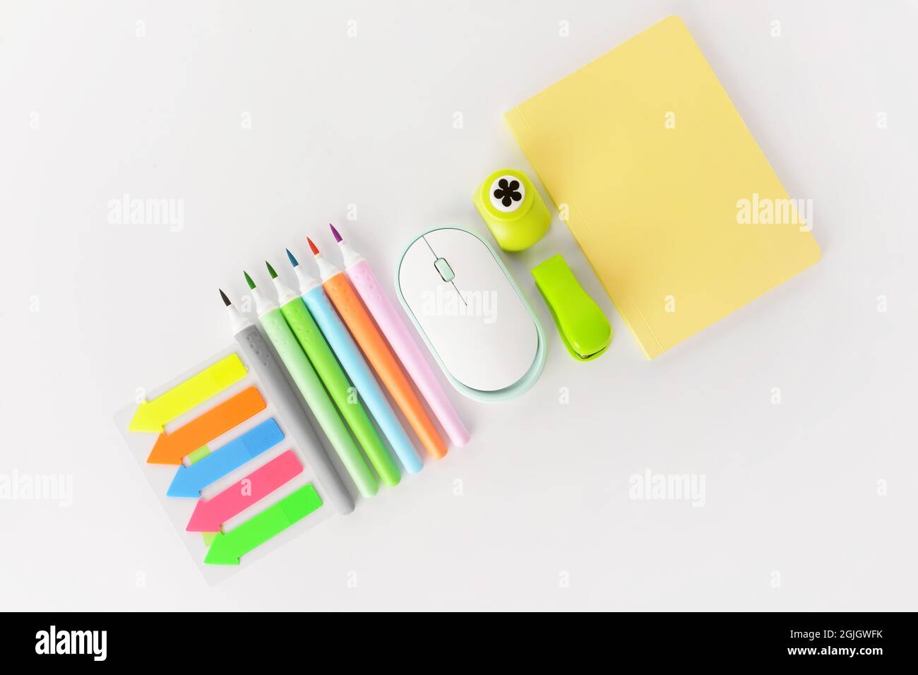 Different stationery supplies and computer mouse on white background ...