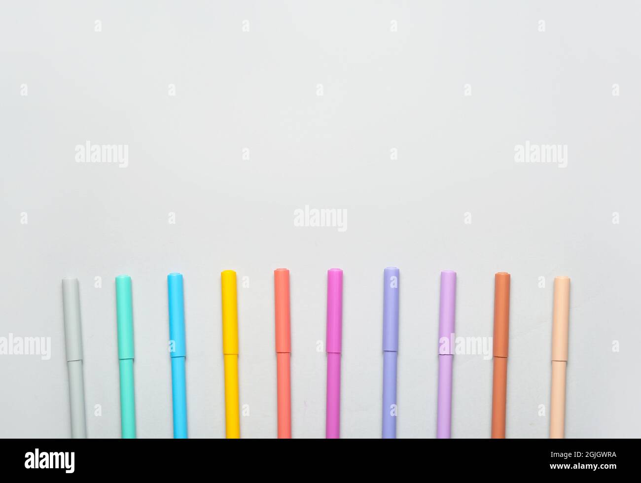 Colorful markers on light background Stock Photo - Alamy