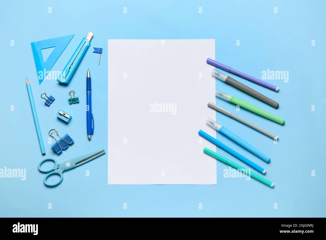 Blank paper sheet and stationery supplies on color background Stock ...