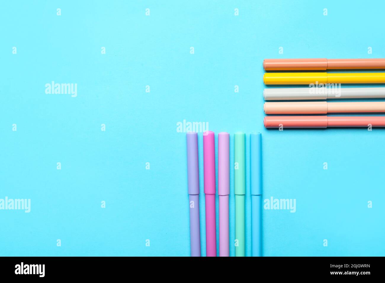 Colorful markers on color background Stock Photo - Alamy
