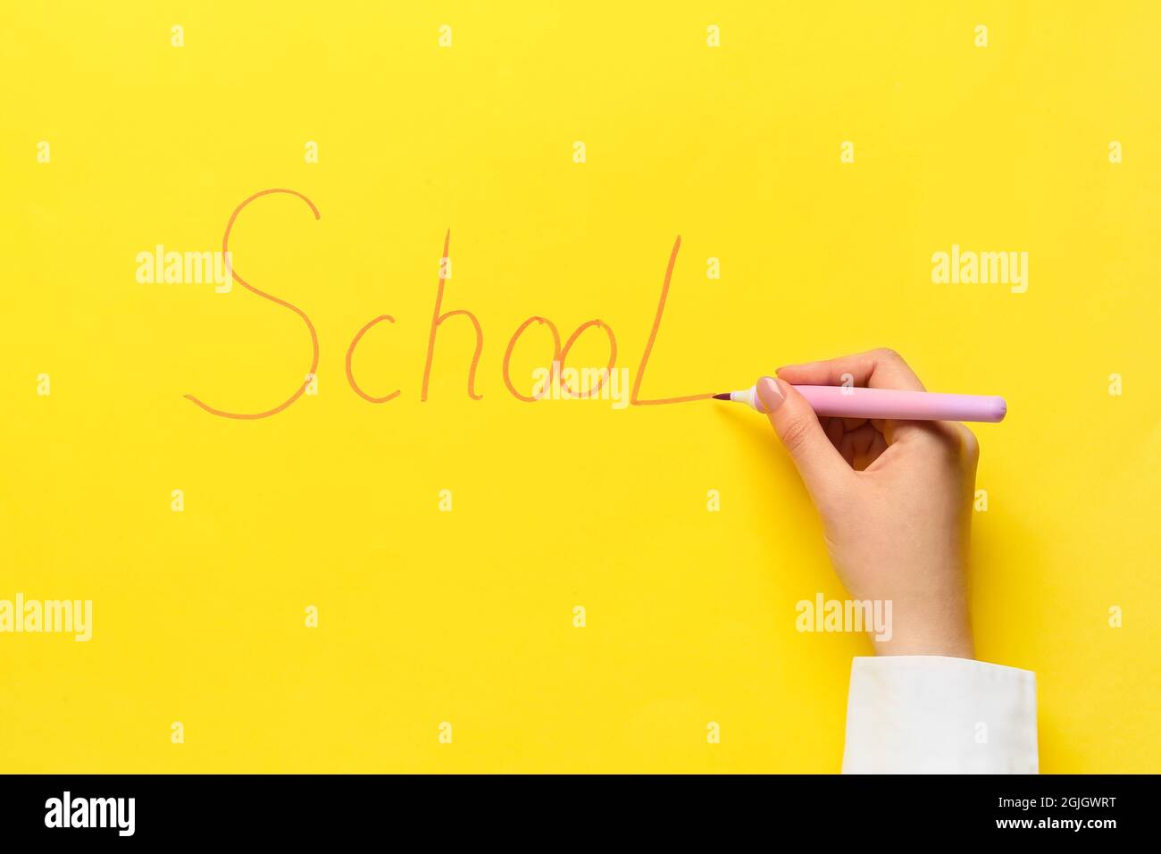Woman writing word homework hi-res stock photography and images - Alamy