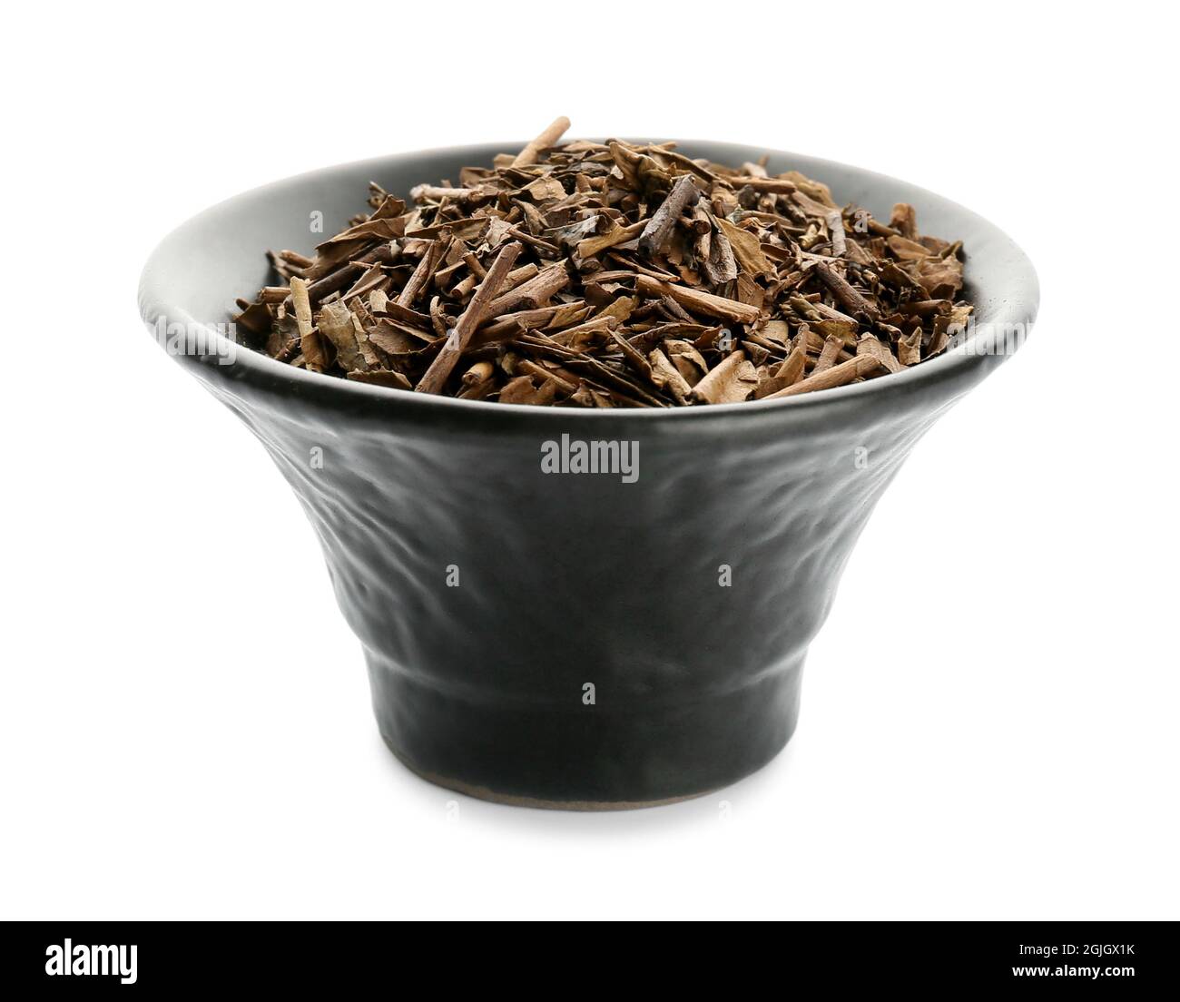 Bowl of dry hojicha green tea on white background Stock Photo - Alamy