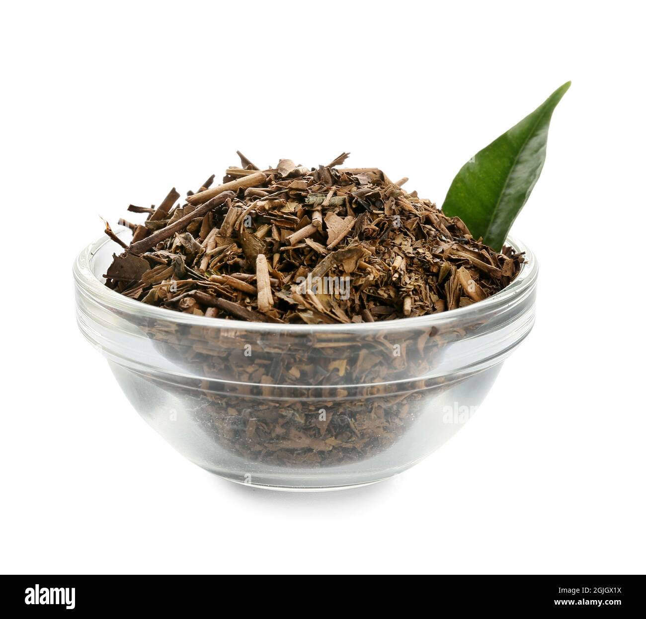 Bowl of dry hojicha green tea on white background Stock Photo - Alamy