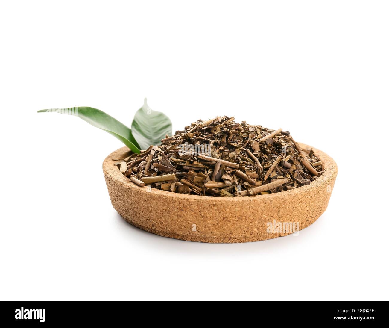 Bowl of dry hojicha green tea on white background Stock Photo - Alamy