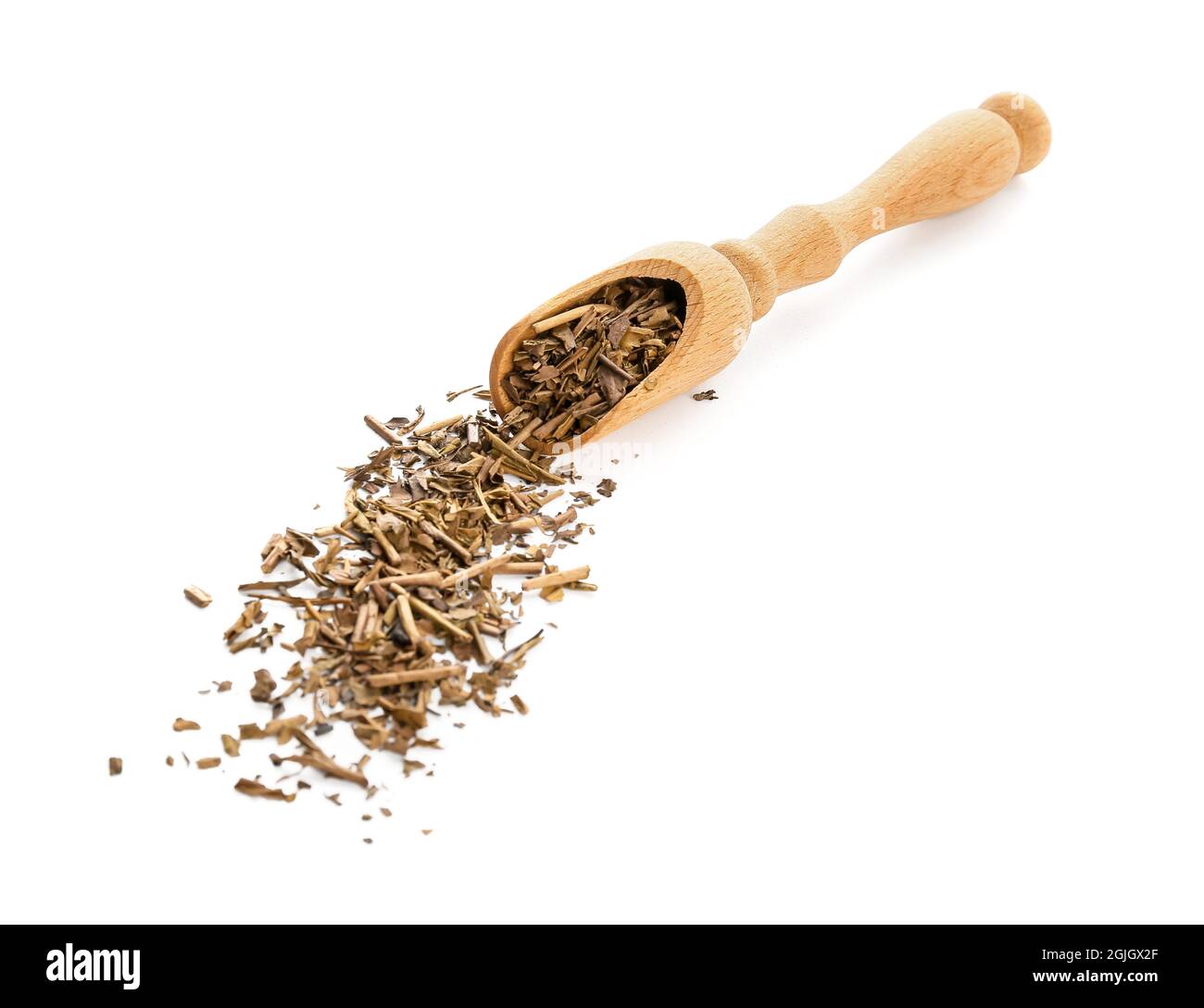 Scoop with dry hojicha green tea on white background Stock Photo - Alamy