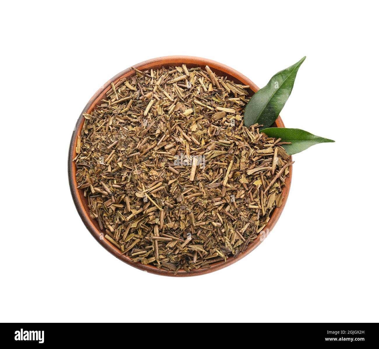 Plate with dry hojicha green tea on white background Stock Photo - Alamy
