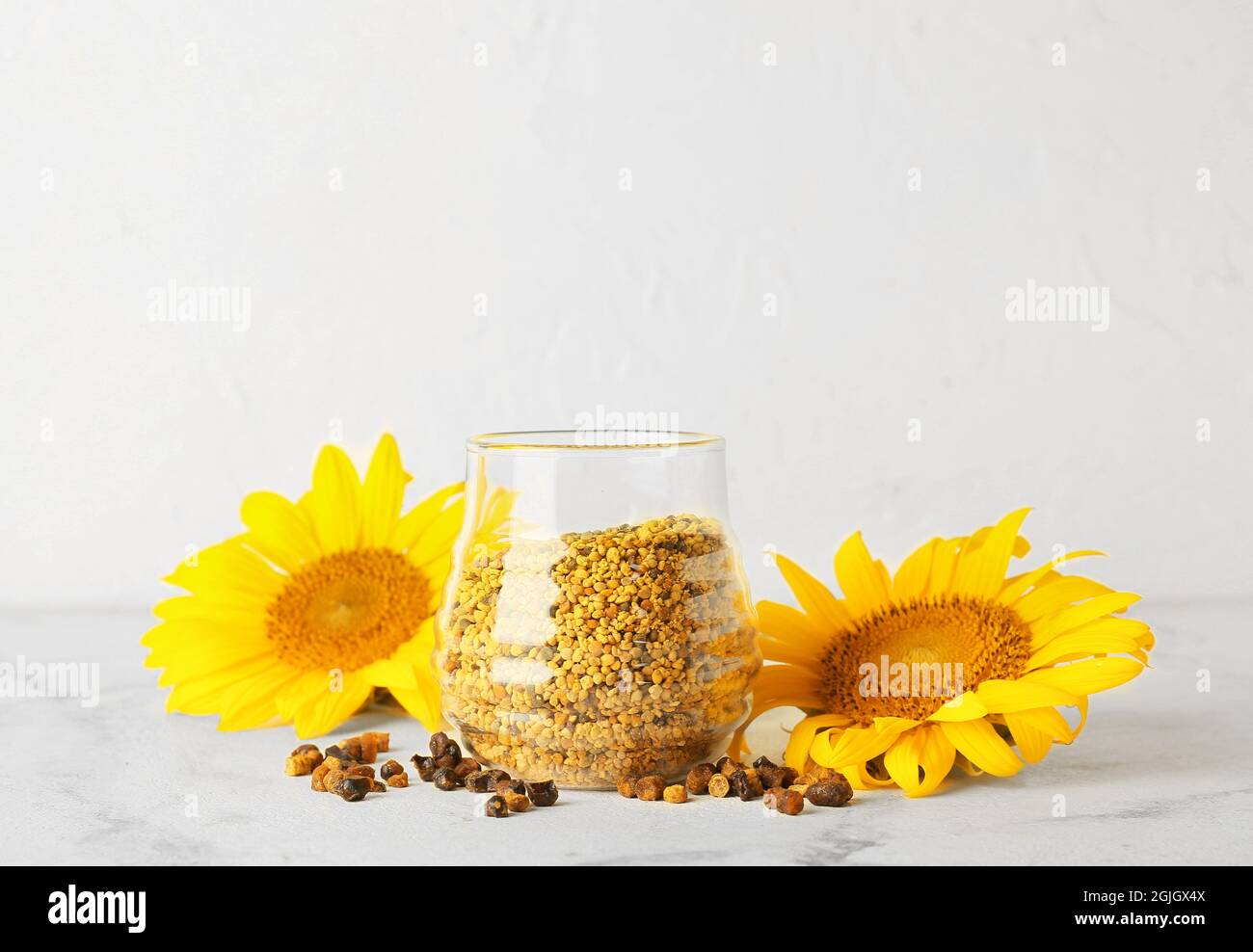 Jar of bee pollen and beebread on white background Stock Photo - Alamy