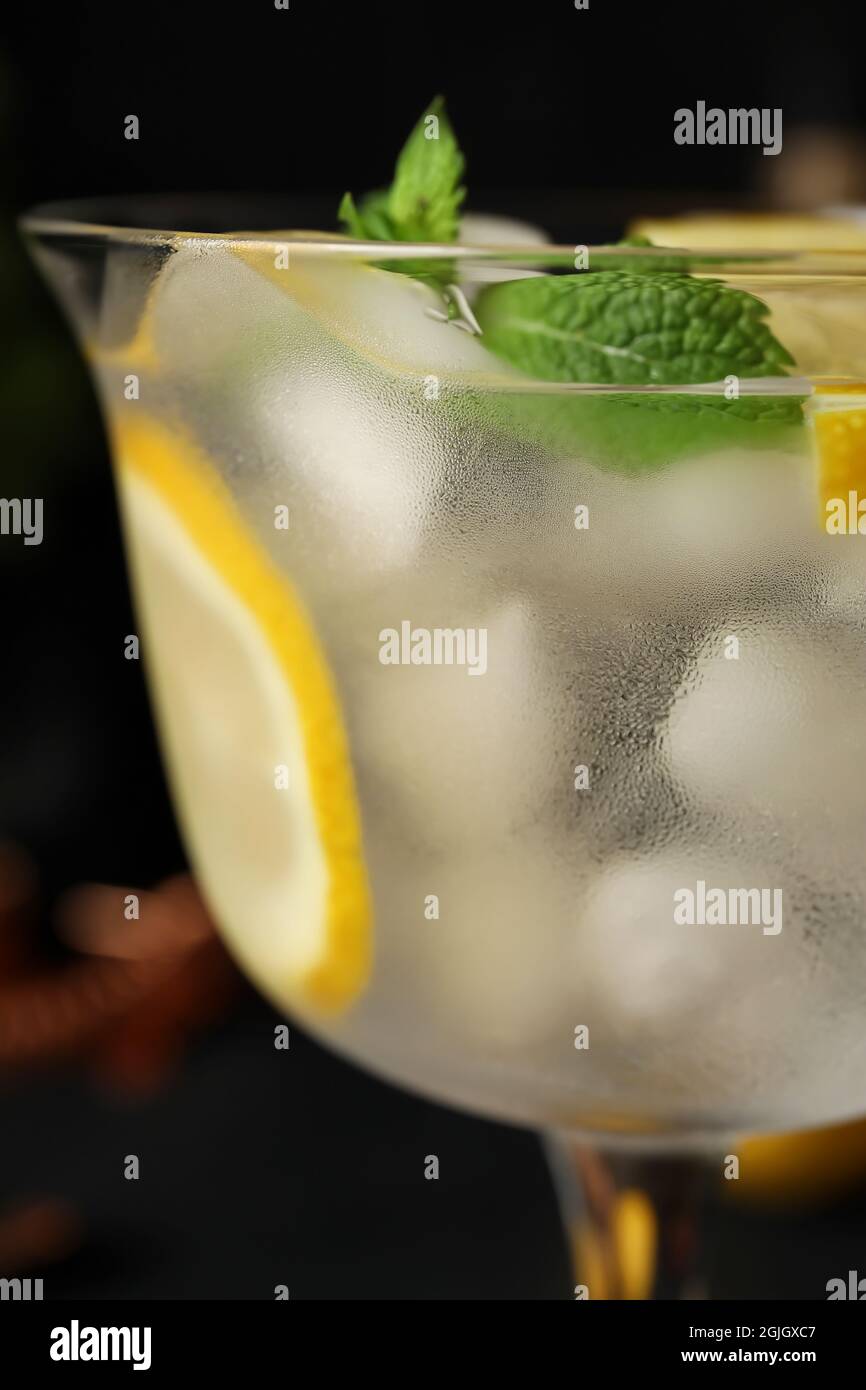 Glass of cold gin and tonic on dark background, closeup Stock Photo - Alamy