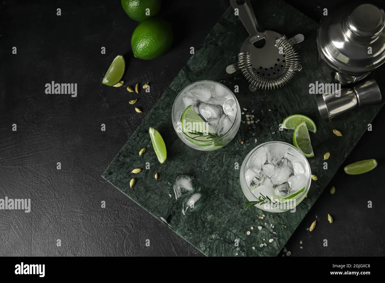 Glasses of cold gin and tonic on dark background Stock Photo - Alamy