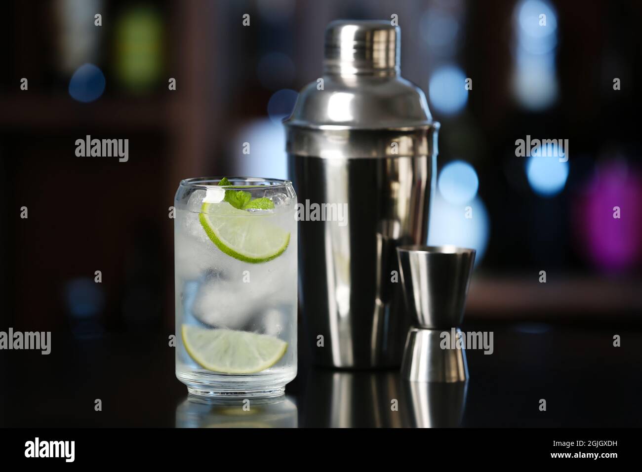 Glass of cold gin tonic on table in bar Stock Photo - Alamy