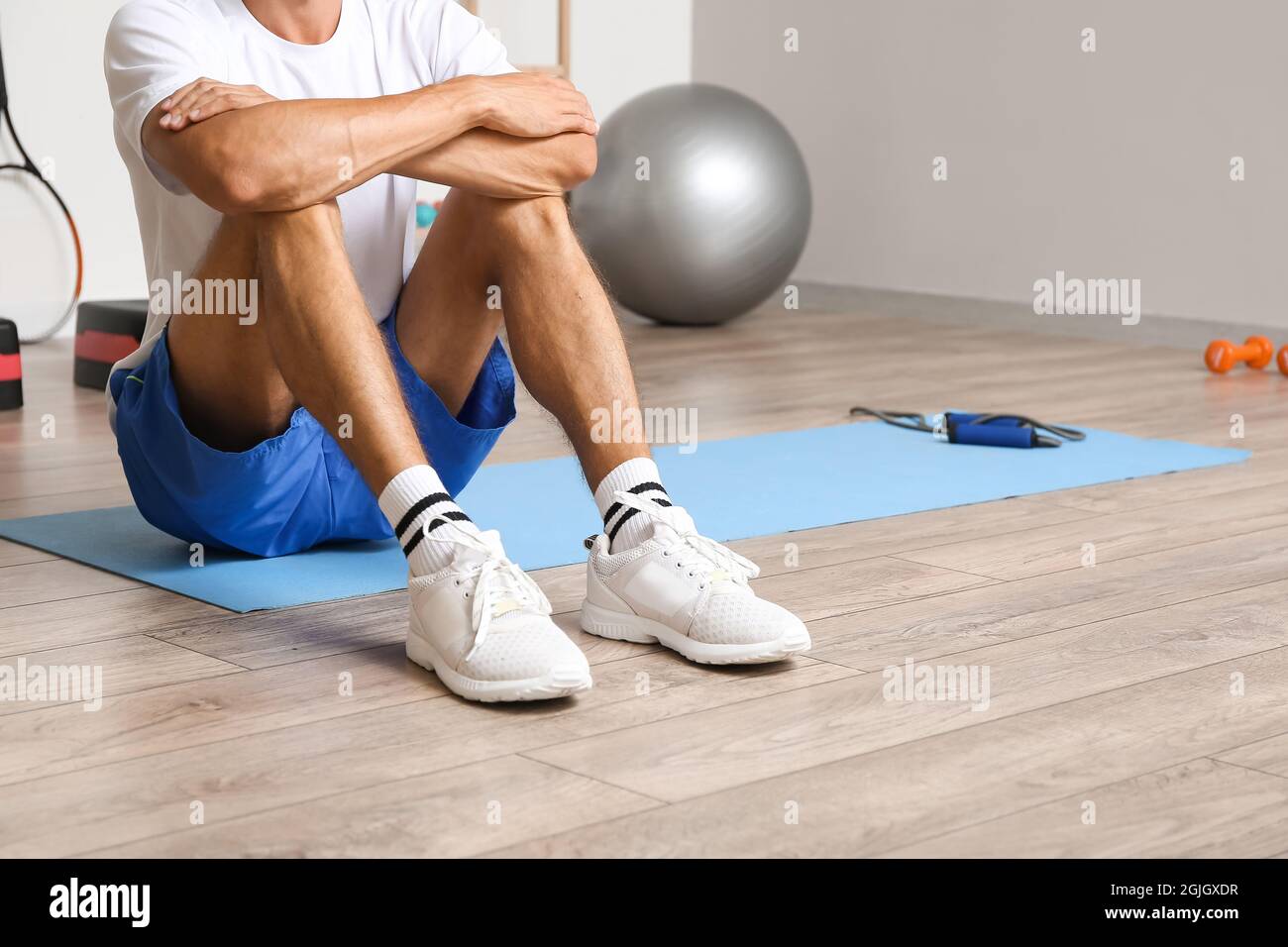Man sitting floor muscles hi-res stock photography and images - Alamy
