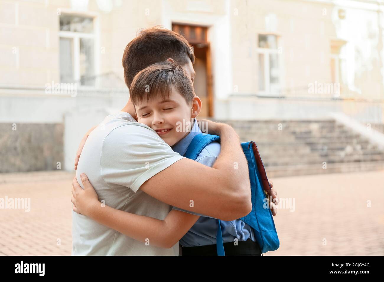 Father saying goodbye to his son near school Stock Photo - Alamy