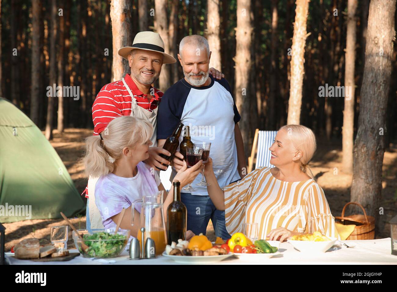 Mature people drinking at barbecue party on summer day Stock Photo - Alamy