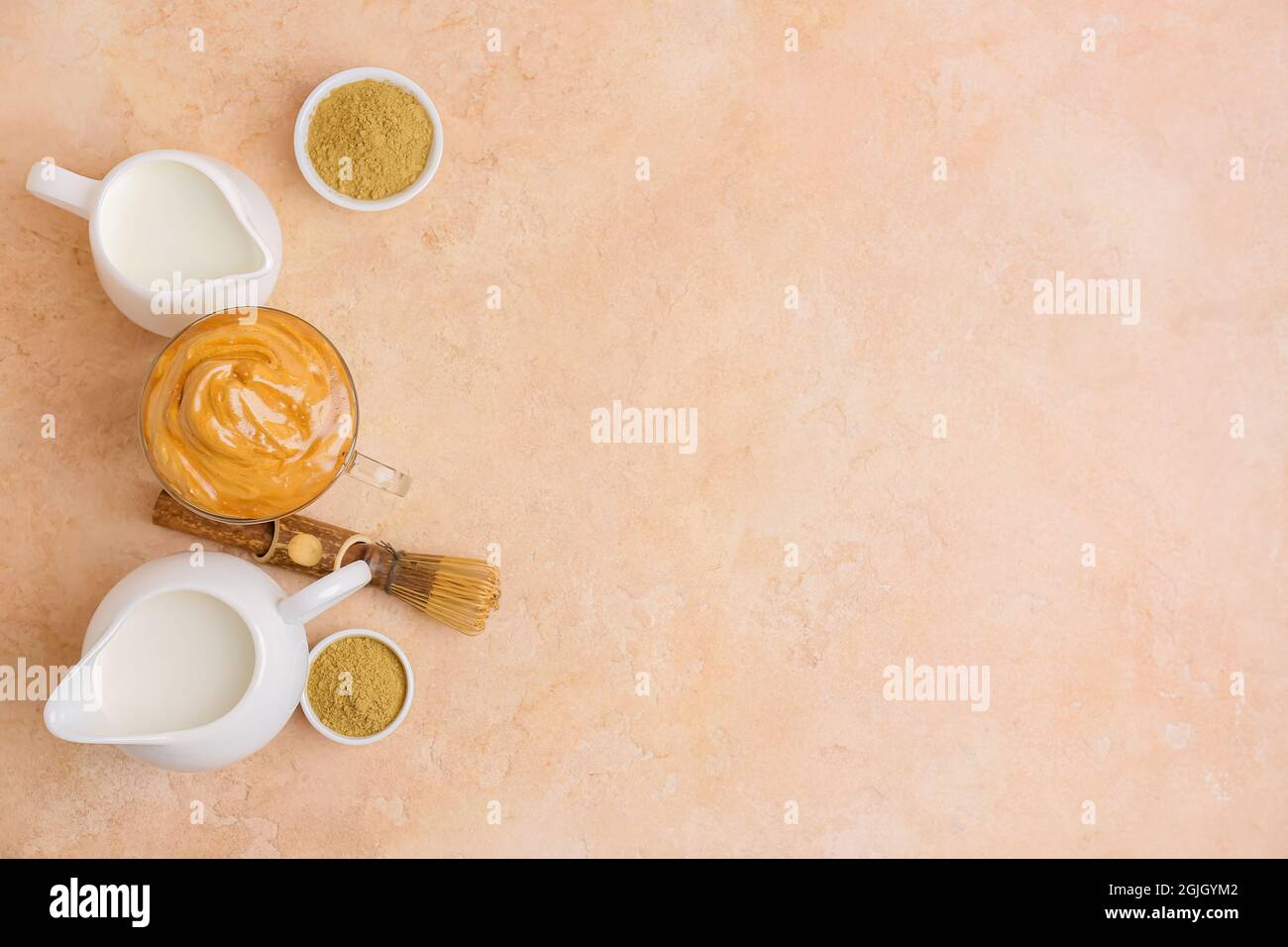 Composition tasty dalgona hojicha latte on color table Stock Photo - Alamy