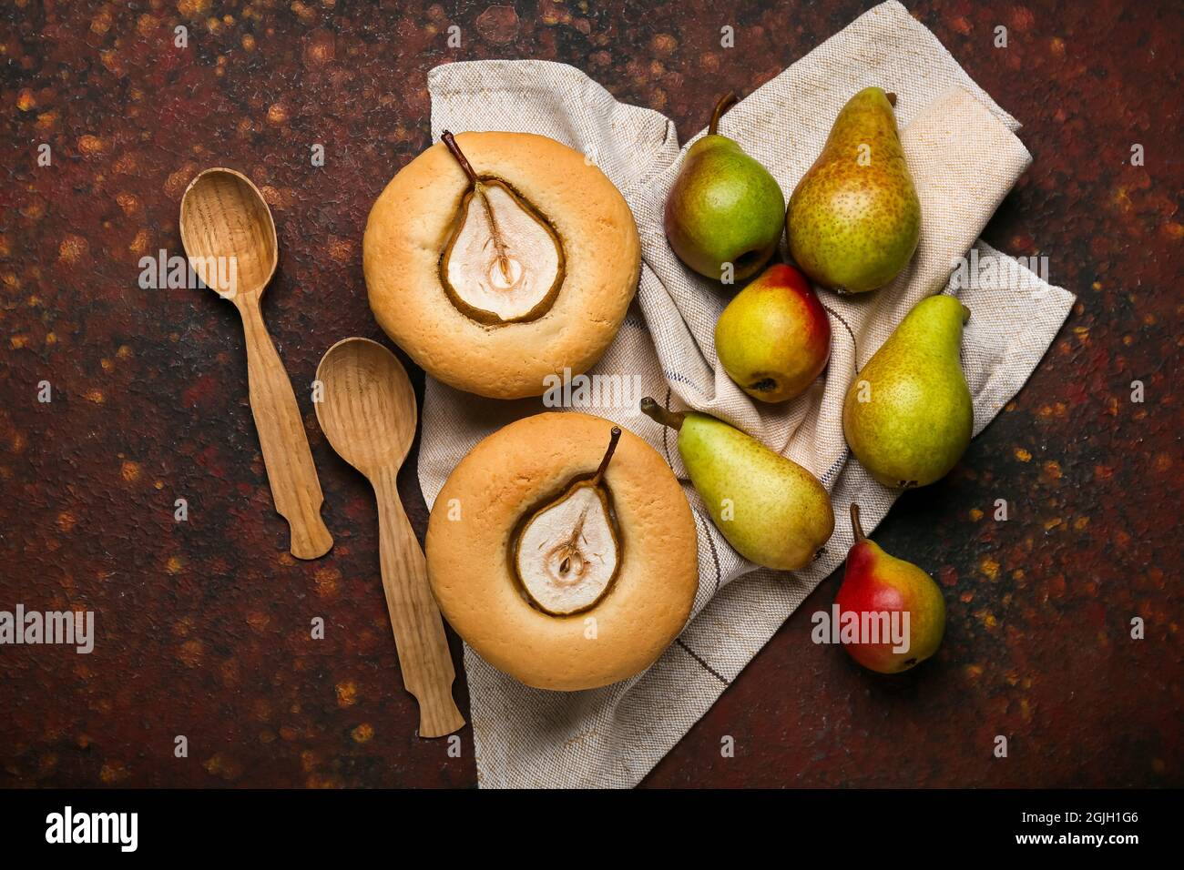 Tasty pear pot pies and fresh fruits on grunge background Stock Photo ...