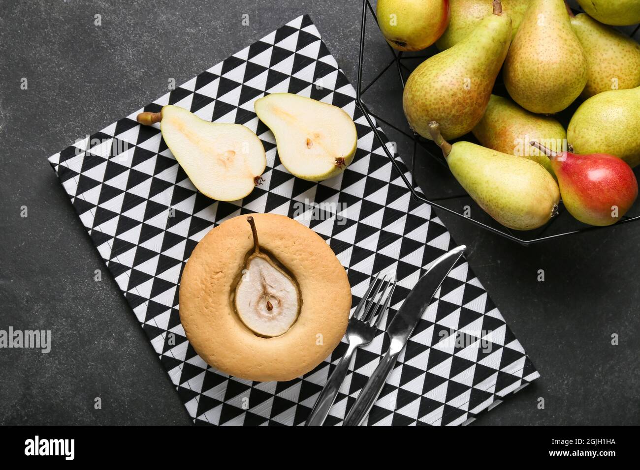 Tasty pear pot pie and fresh fruits on dark background Stock Photo - Alamy