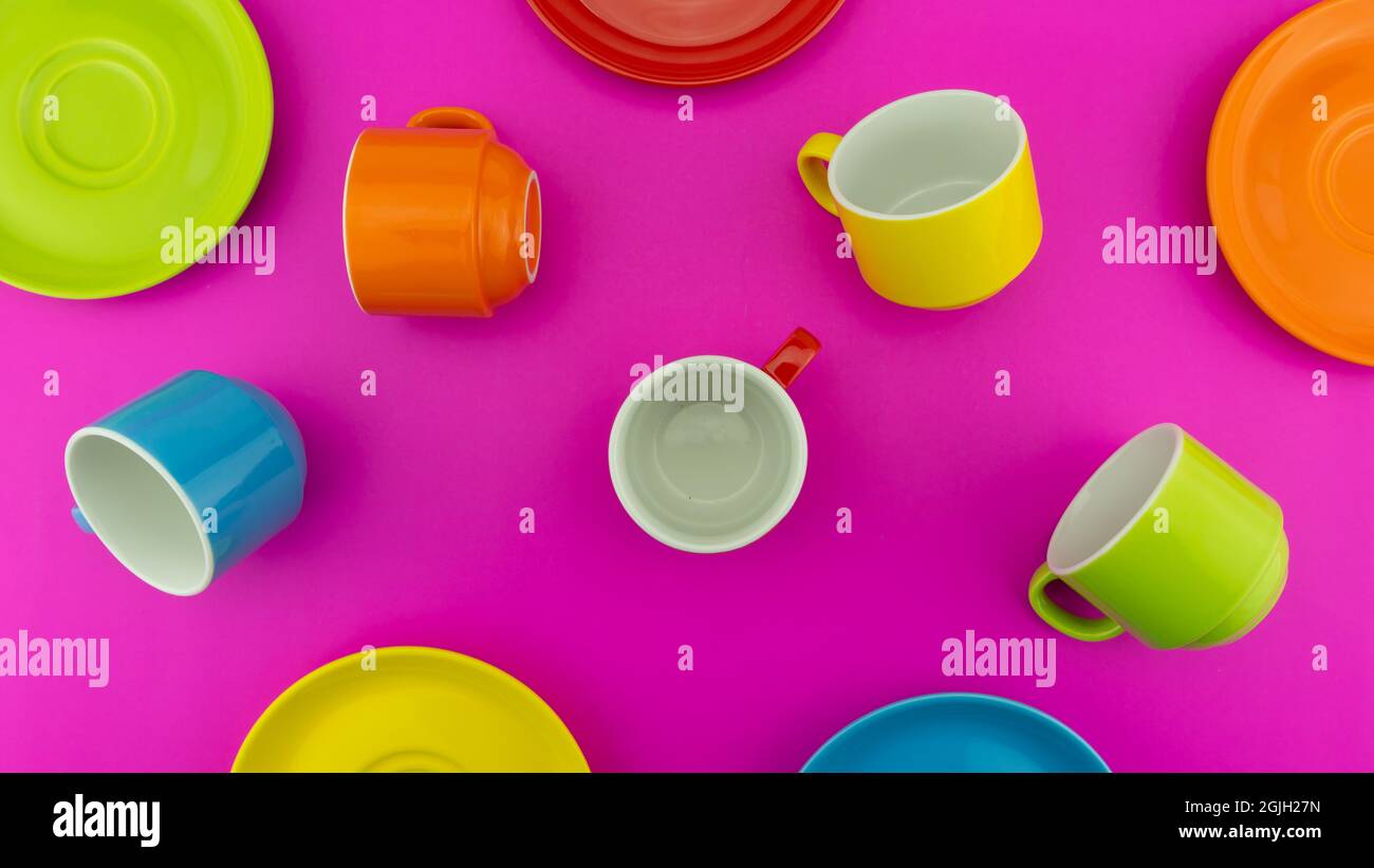 Colorful coffee cup on colorful paper background A lot of cups for ...