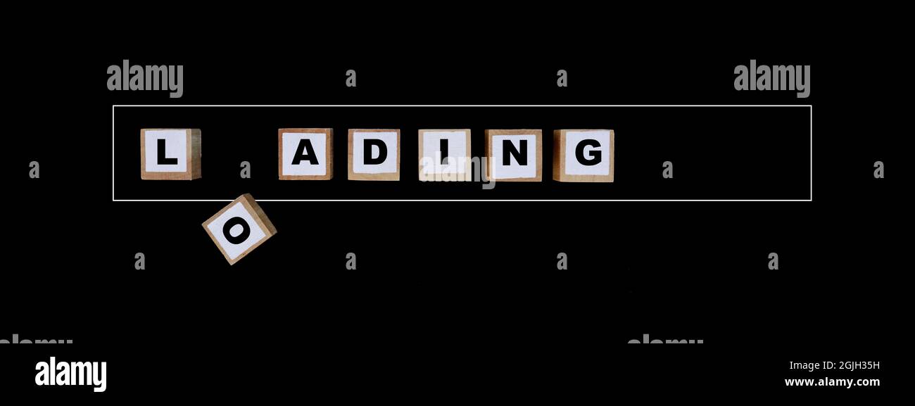 Square wood painted white color with LOADING letters in progress bar on ...