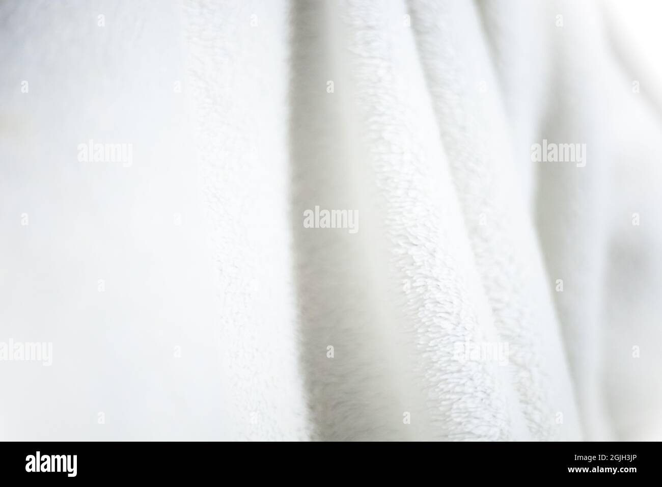 White shaggy blanket texture as background. Fluffy fake textile fur ...