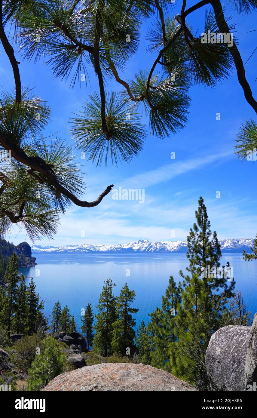 Landscape view of Lake Tahoe with snow-covered mountains and forests ...