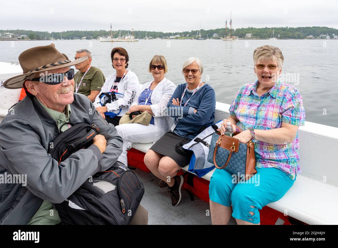Boothbay Harbor, Maine, USA. Group of tourists on a tender boat heading ... Boothbay Harbor, Maine, USA. Group of tourists on a tender boat heading ...
