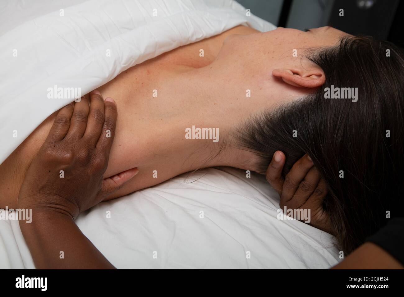 Black Female Massage Therapist Working On A White Female Client Stock 1386