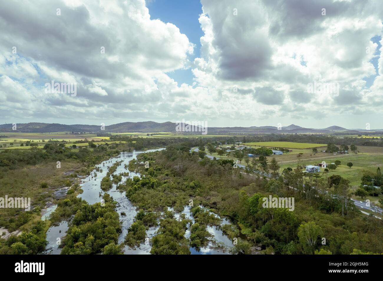 Drone aerial of the Pioneer River Mackay with Marian township in the ...