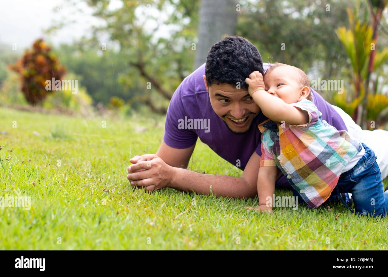 Child touching grass High Resolution Stock Photography and Images - Alamy