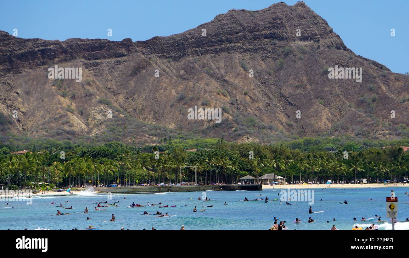 View of a crowded Waikiki Beach and Diamond Head crater in the distance ...